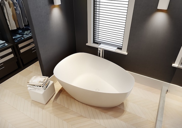 Een luxe badkamer met een solid surface bad - UW-badkamer.nl